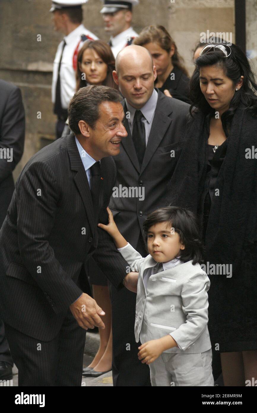 President Nicolas Sarkozy kisses Taddei Pompidou, great grandson of ...
