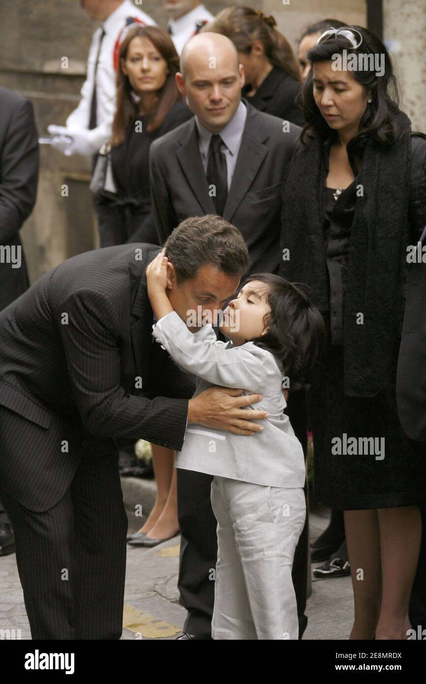 President Nicolas Sarkozy kisses Taddei Pompidou, great grandson of ...