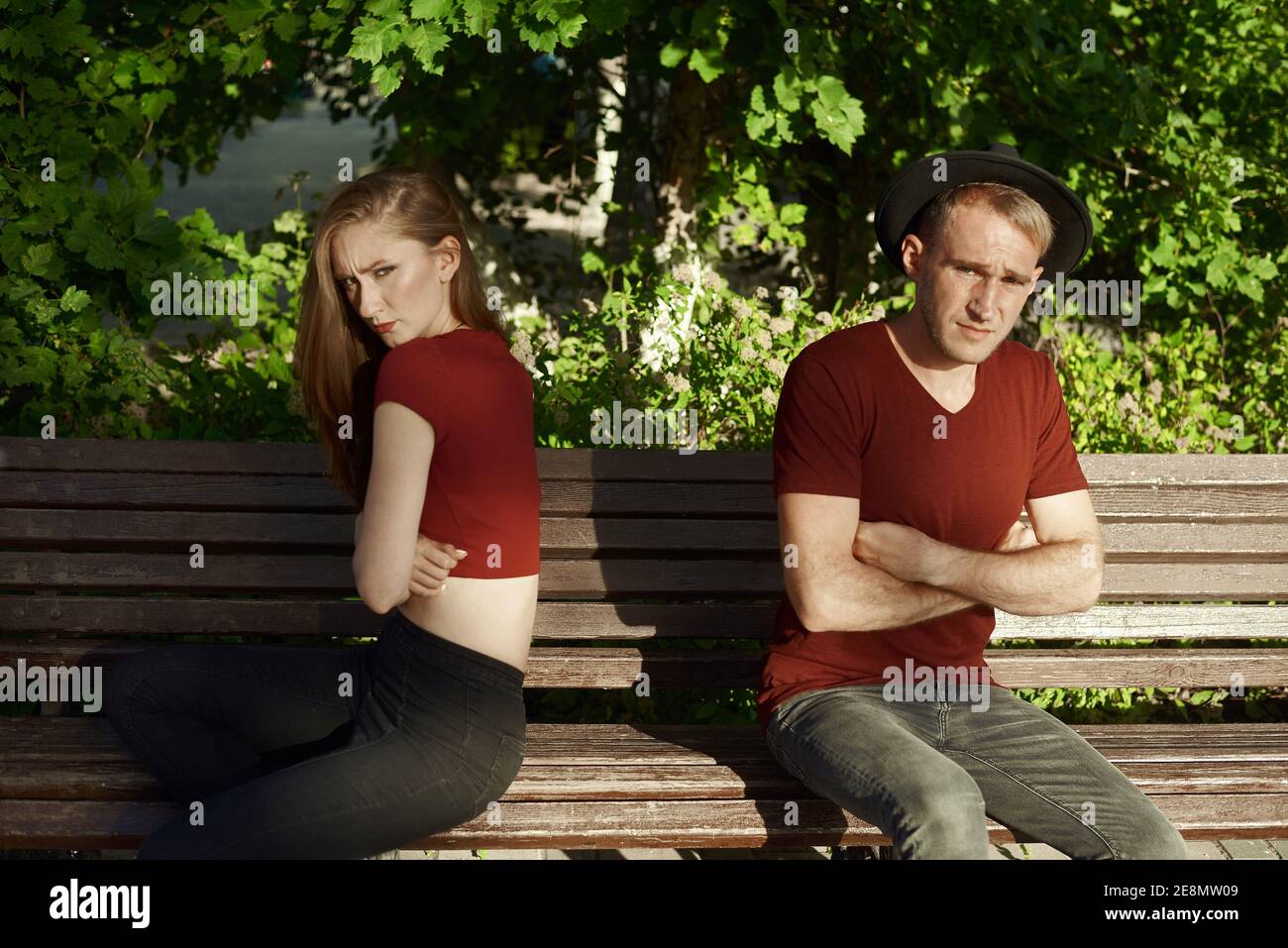 A couple is breaking up. The boy and girl is siting back to each other ...