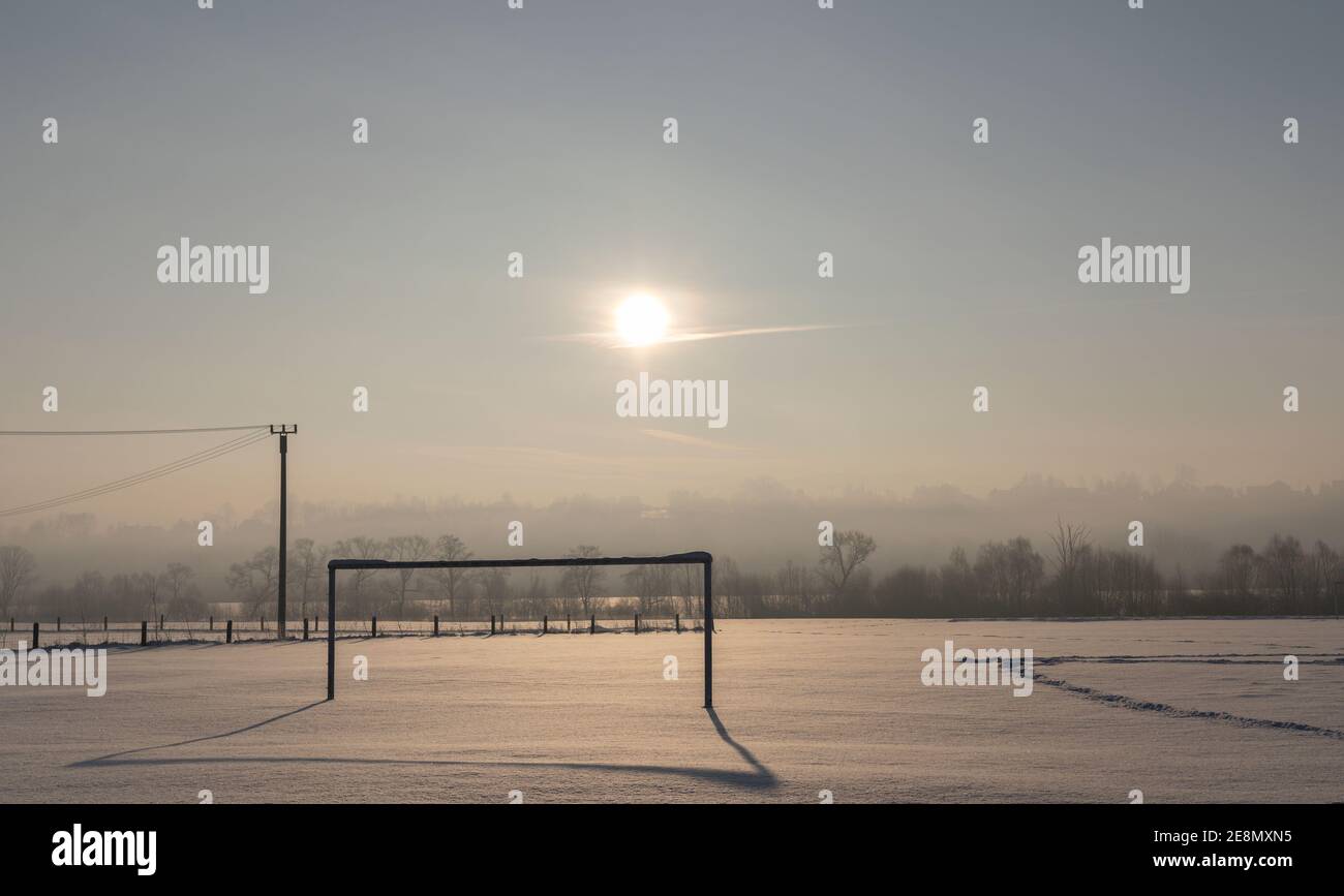 Abandoned soccer field, seen in the morning, covered in snow Stock ...