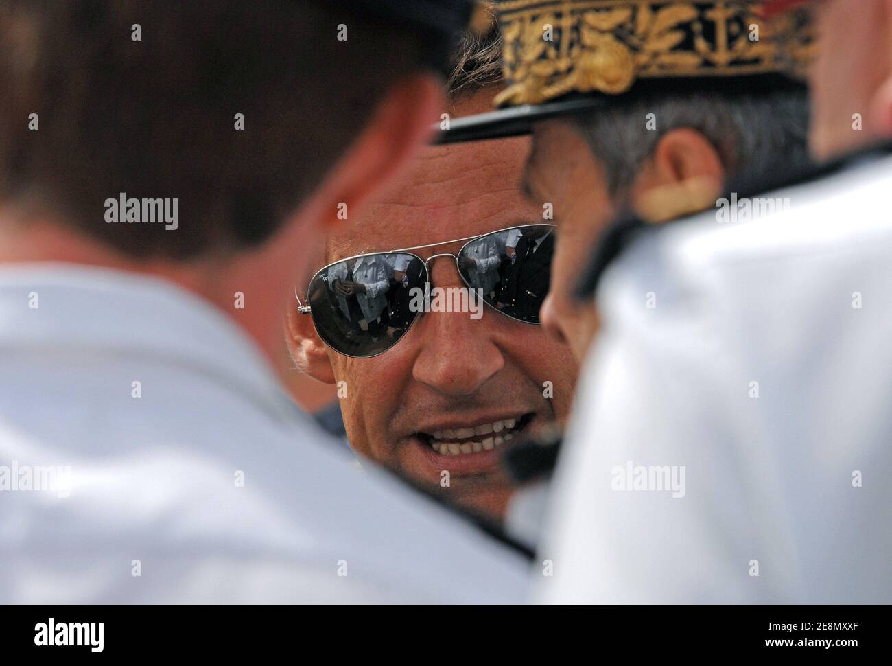 French President Nicolas Sarkozy talks with navy officer at the nuclear ...