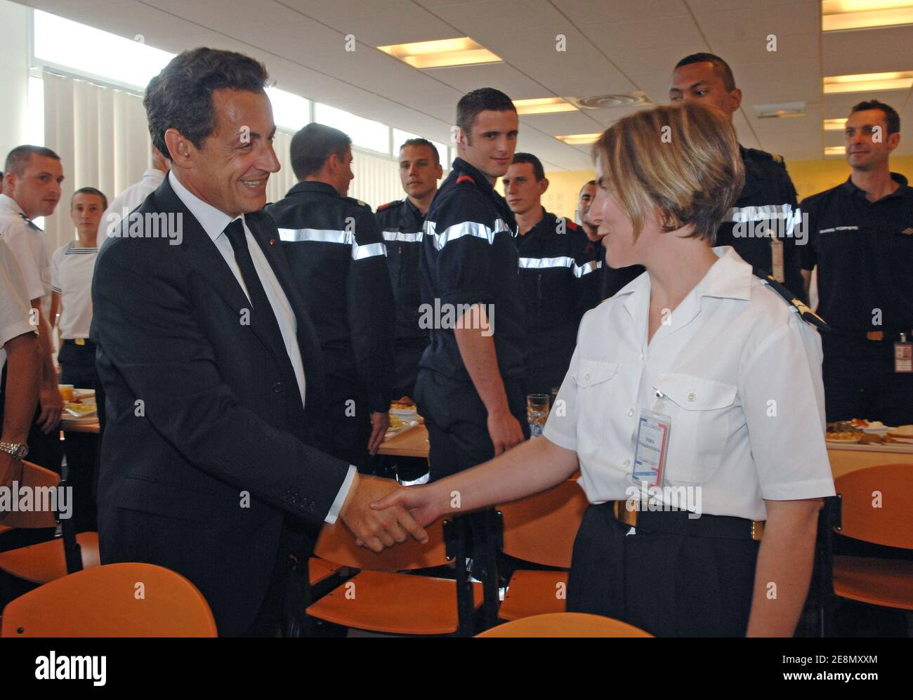 French President Nicolas Sarkozy talks with navy officer at the nuclear ...