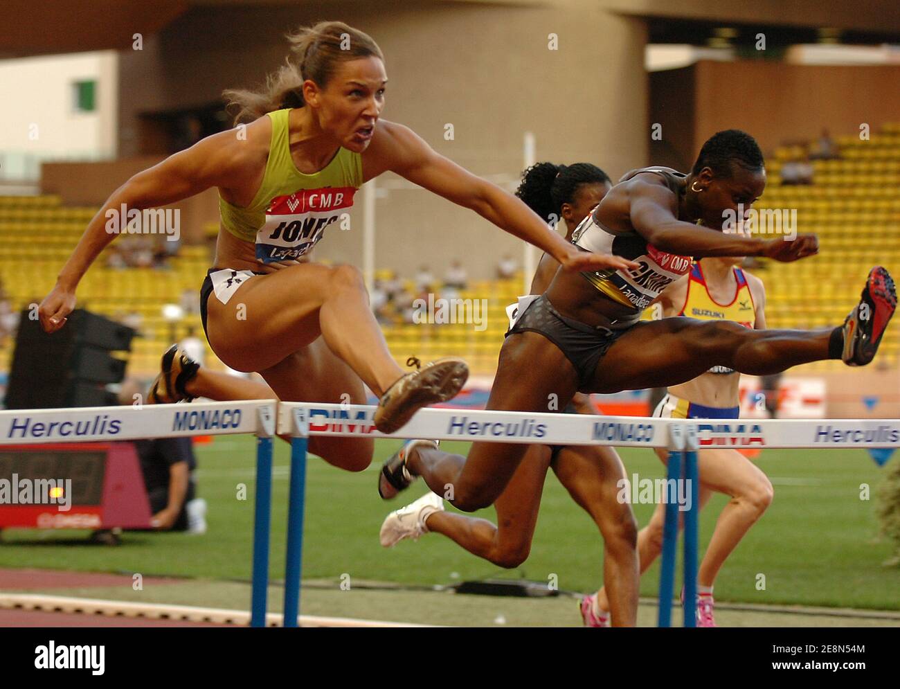 USA's Lolo Jones and Damu Cherry compete on women's 100 meters hurdles ...