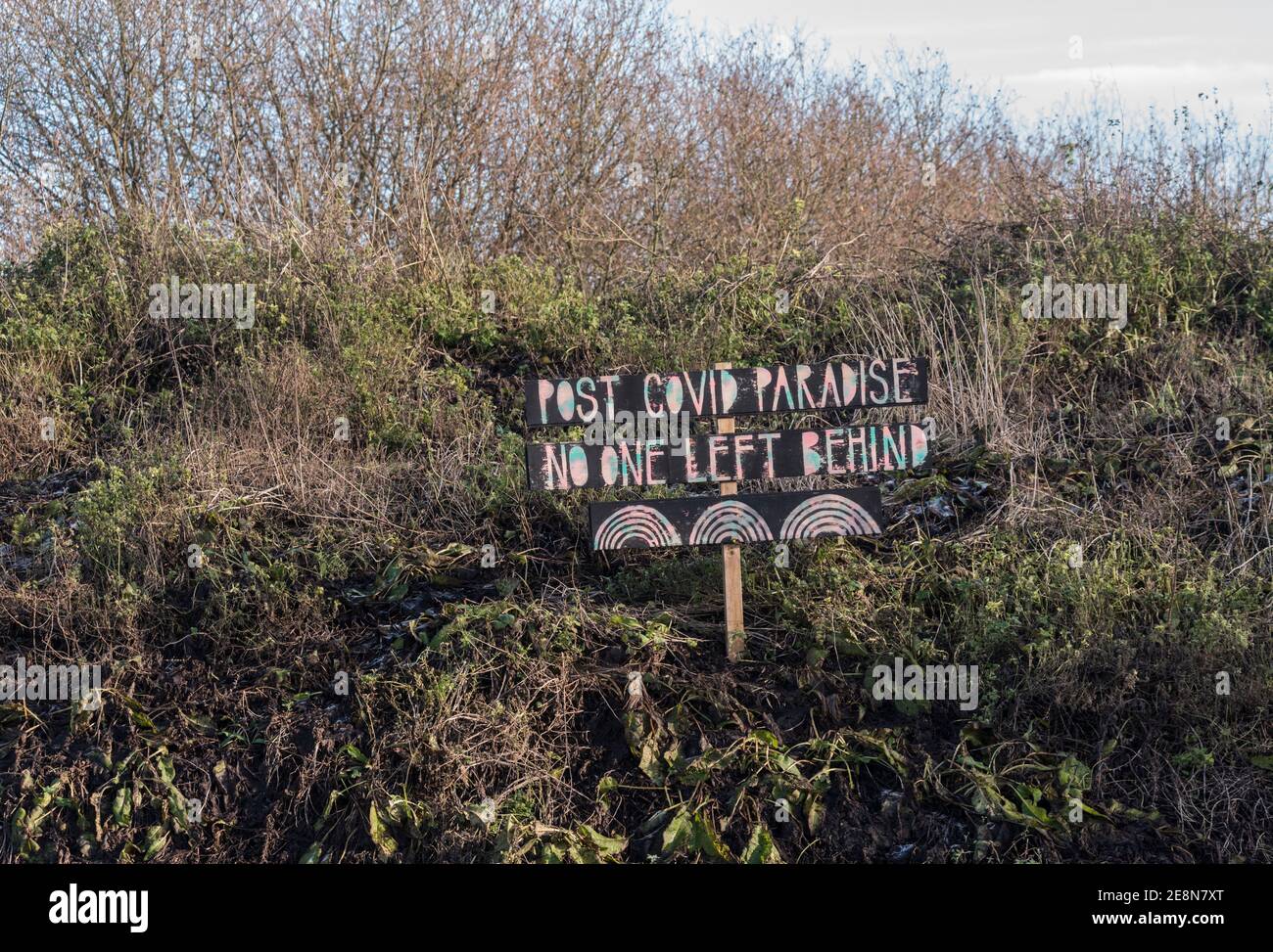 Riverside sign sayin "Post Covid Paradise - No One Left Behind Stock ...