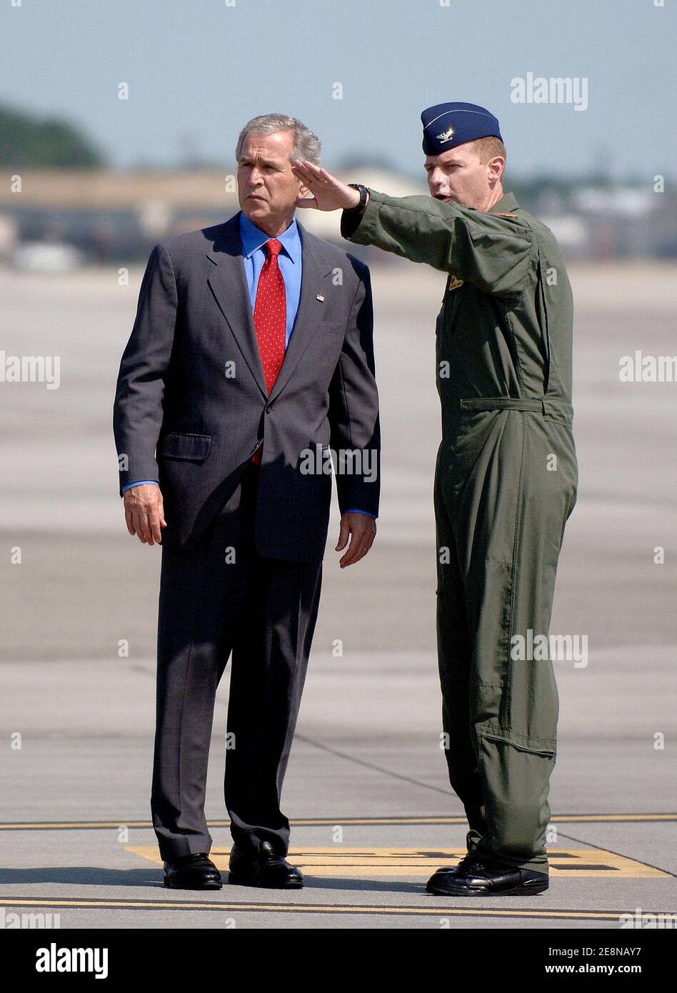 President George W. Bush speaks with an Air Force pilot during a visit ...