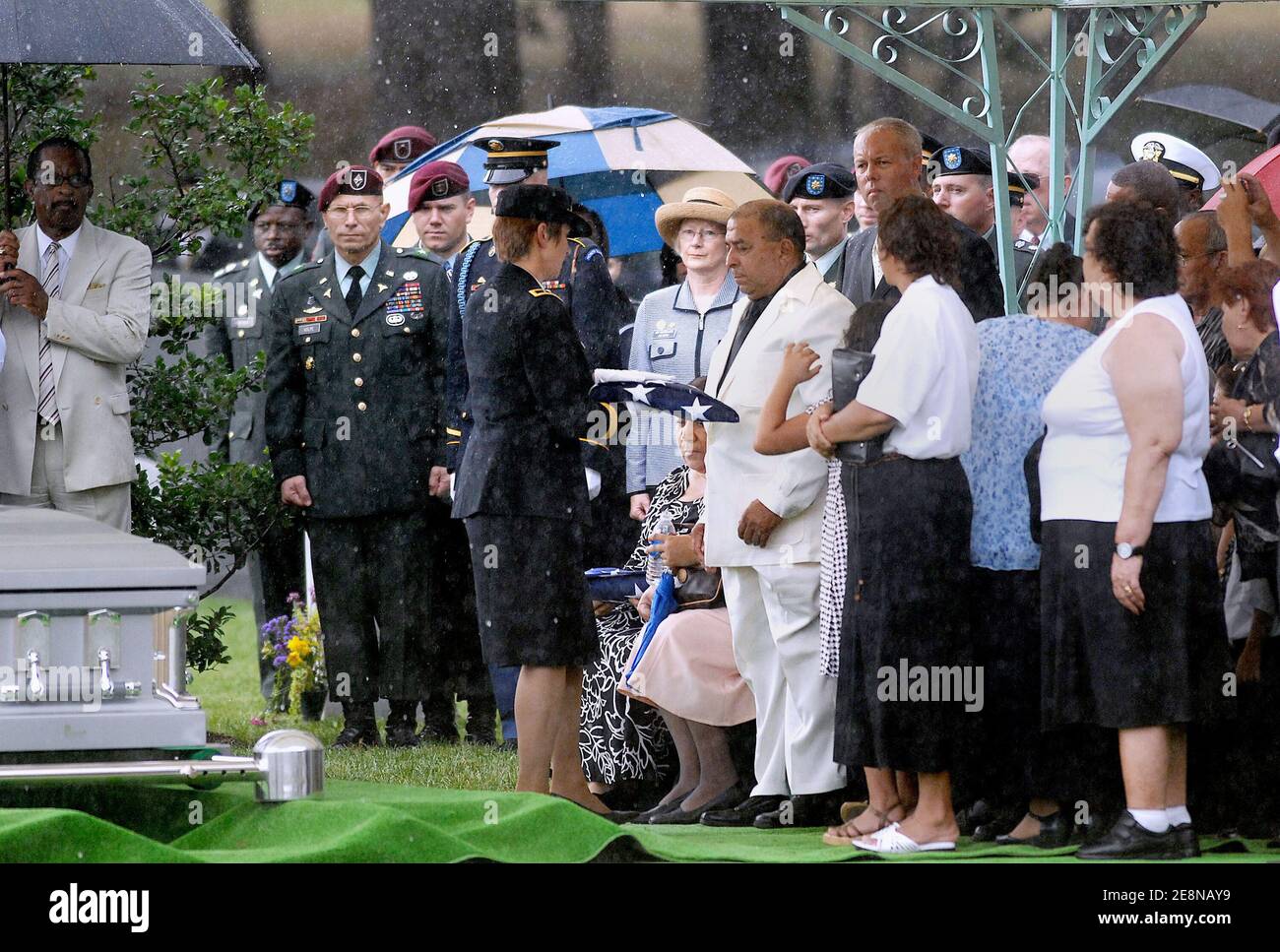 Heavy rain during a funeral service for U.S. Army Captain Maria Ines ...