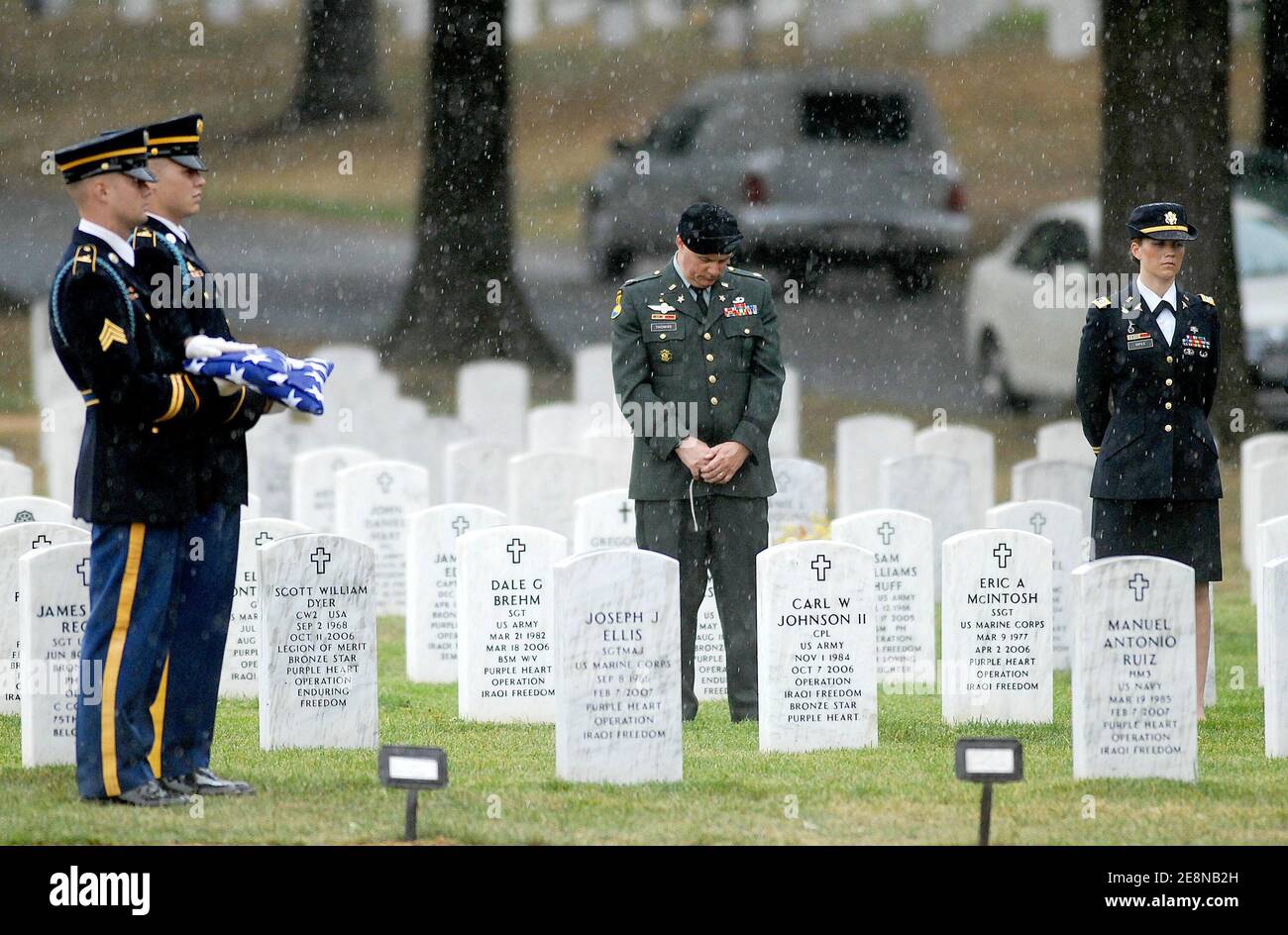 Heavy rain during a funeral service for U.S. Army Captain Maria Ines ...