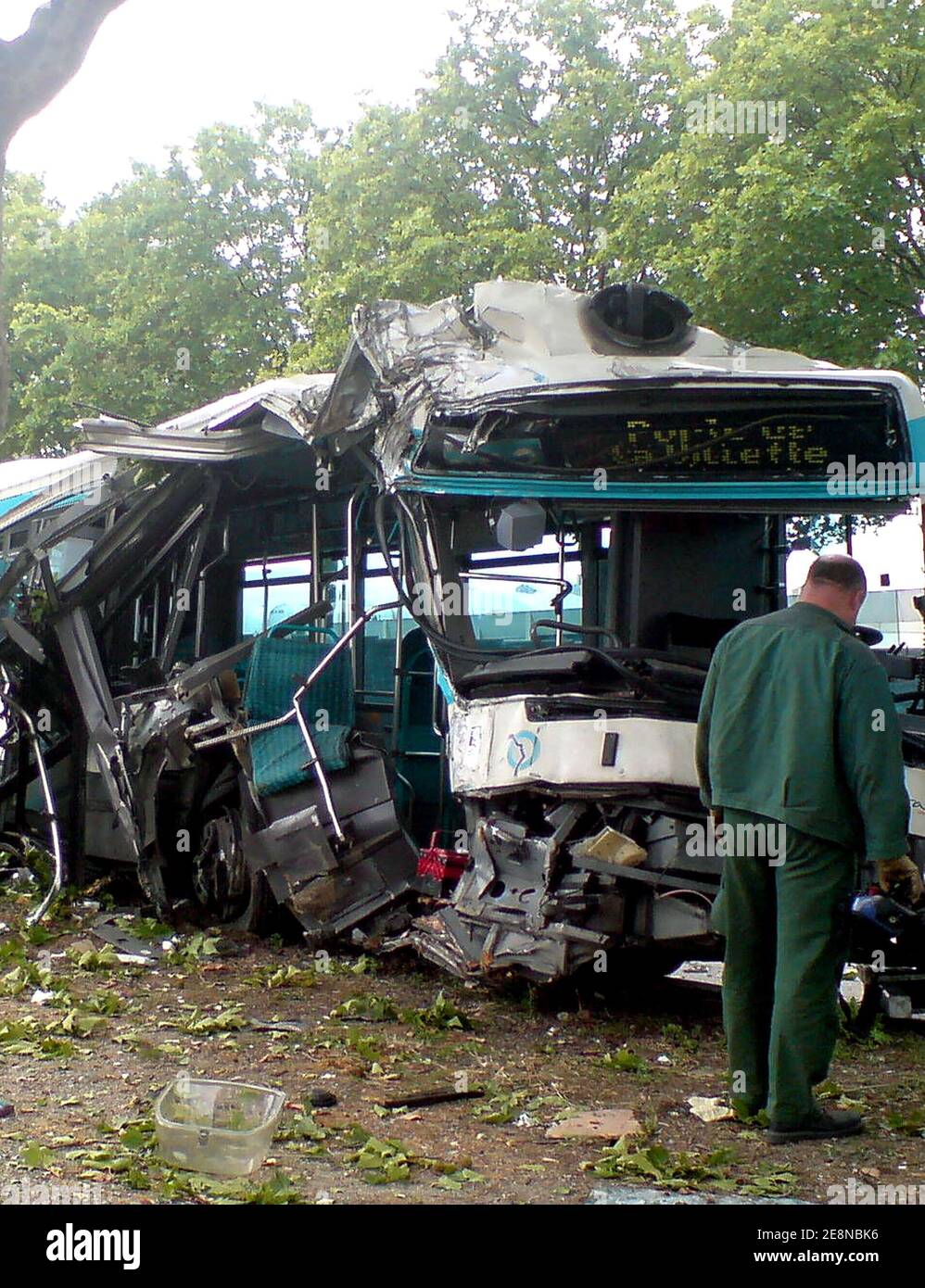 Police crash officers look at the scene after a Parisian RATP bus ...