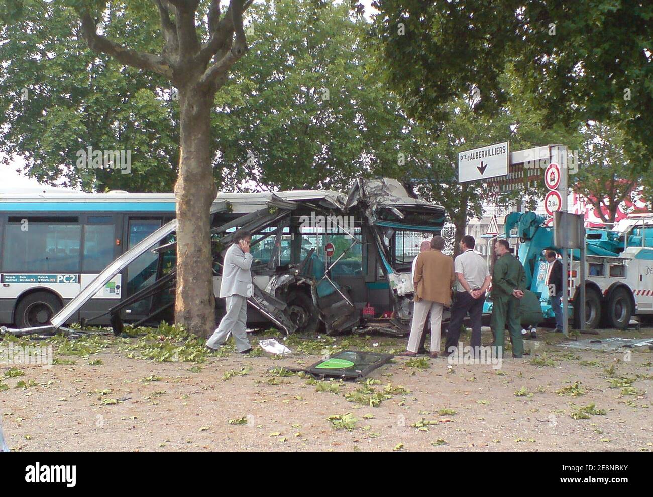 Police crash officers look at the scene after a Parisian RATP bus ...