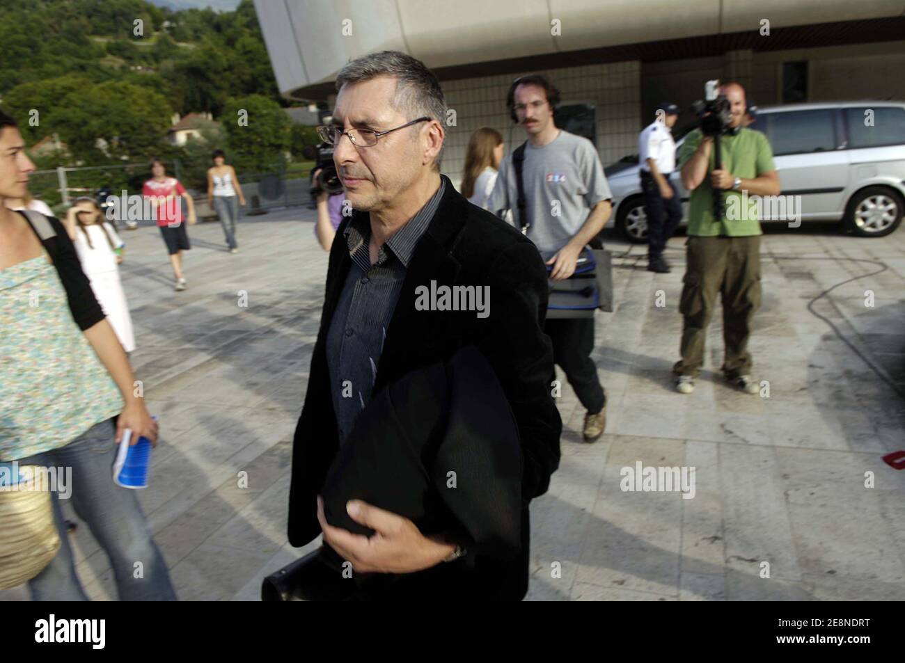 Virginie Labrosse's lawyer Michel Jugnet speaks with journalists front ...