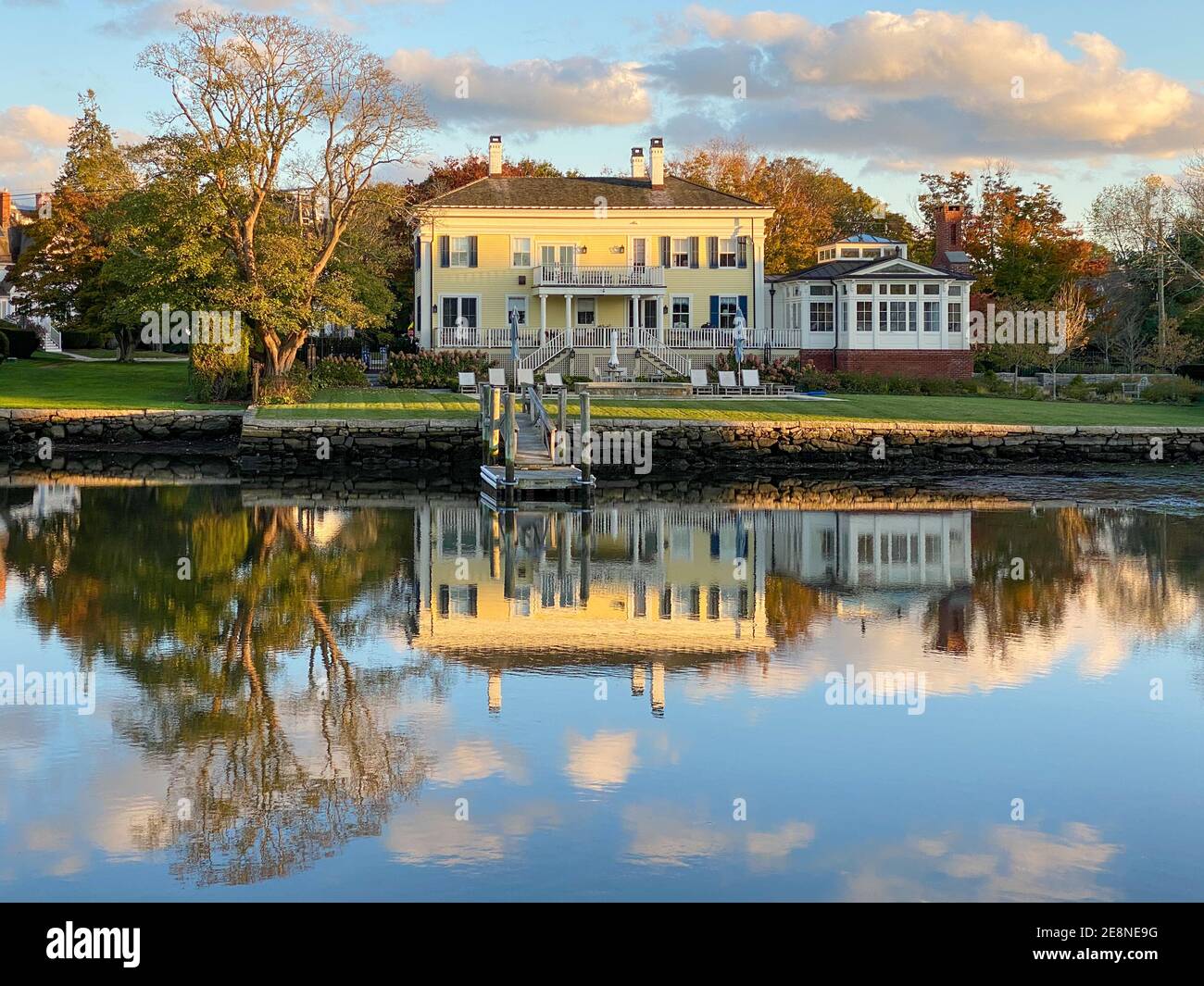 Sunset along the Mystic River in Mystic, Connecticut as reflections ...