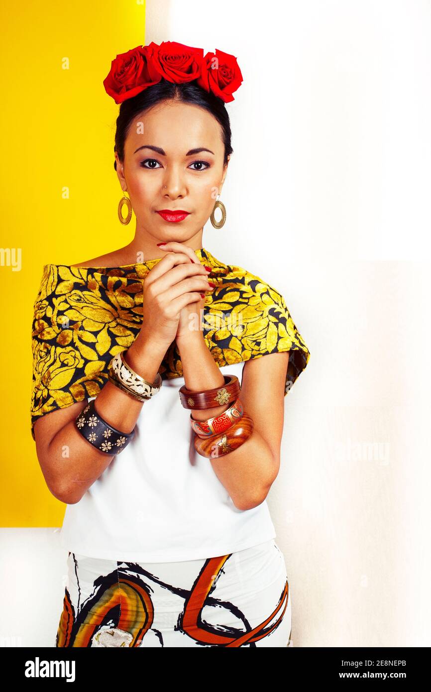young pretty mexican woman smiling happy on yellow background ...