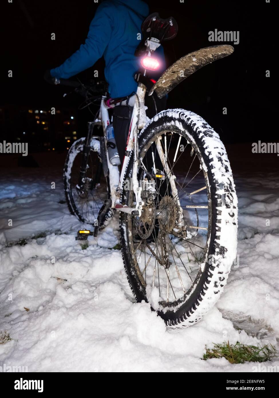 Mountain bike rider boy in winter. Young man riding fat tyre bicycle in ...
