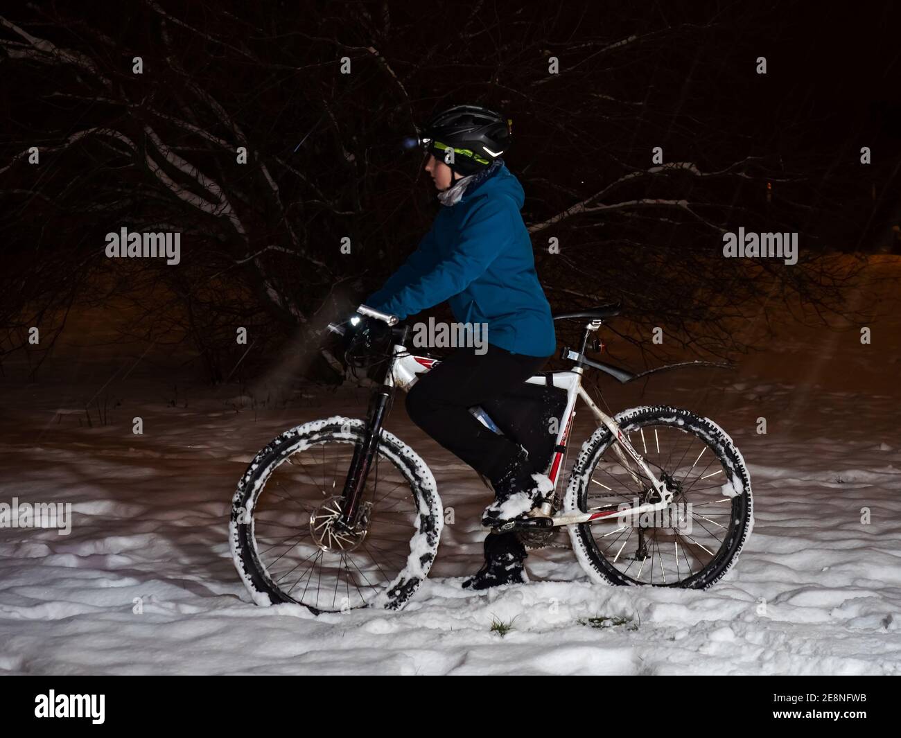 Mountain bike rider boy in winter. Young man riding fat tyre bicycle in ...