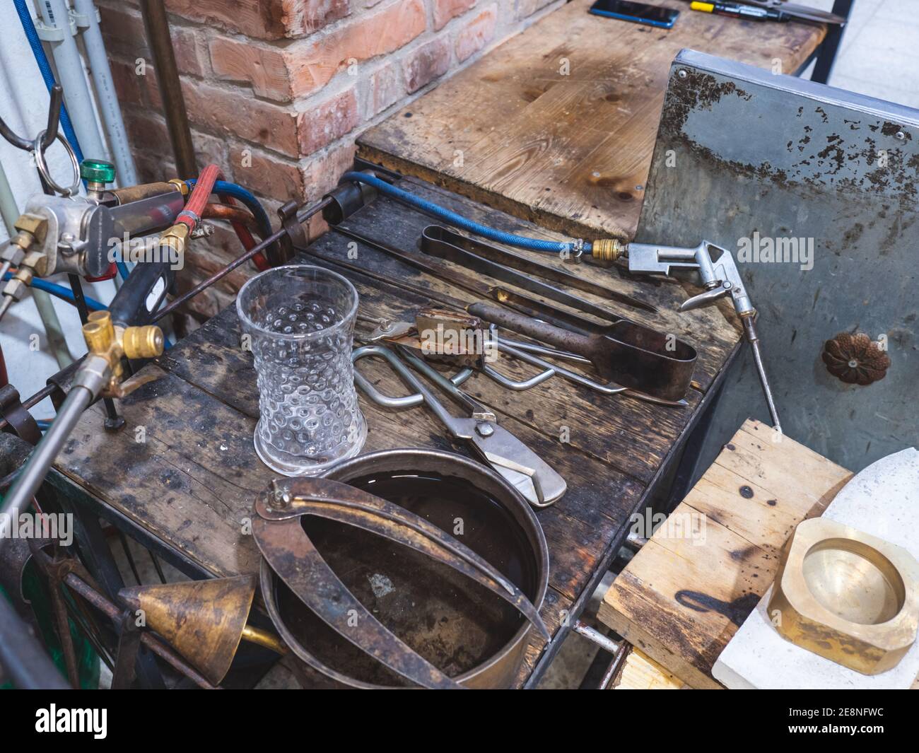 Detailed glassblower tools in workshop. Glassforming tool that involves ...