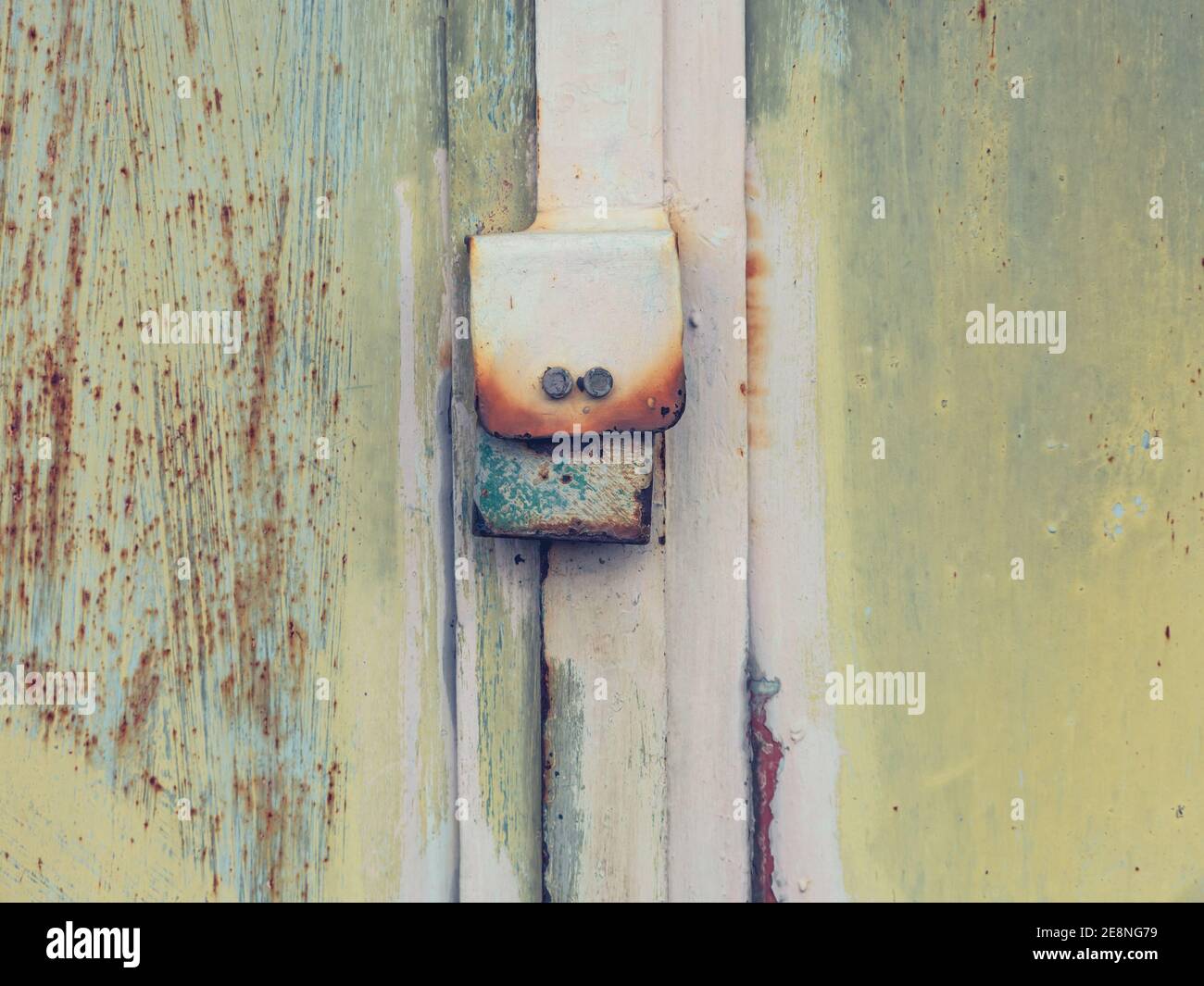 Padlock used in bolt eye welded on industrial frame. Warehouse entrance ...