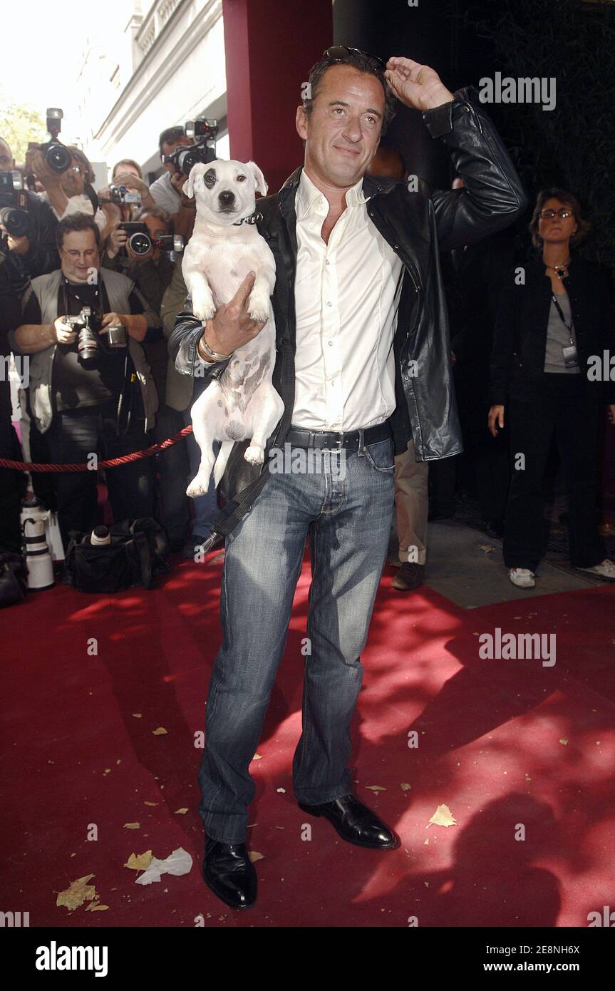 Tv show presenter Christophe Dechavanne with his dog Adeck attends the ...