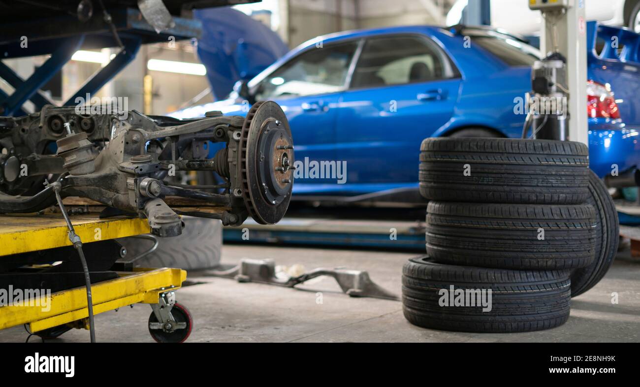 the disassembled car parts in the auto workshop, machine service ...