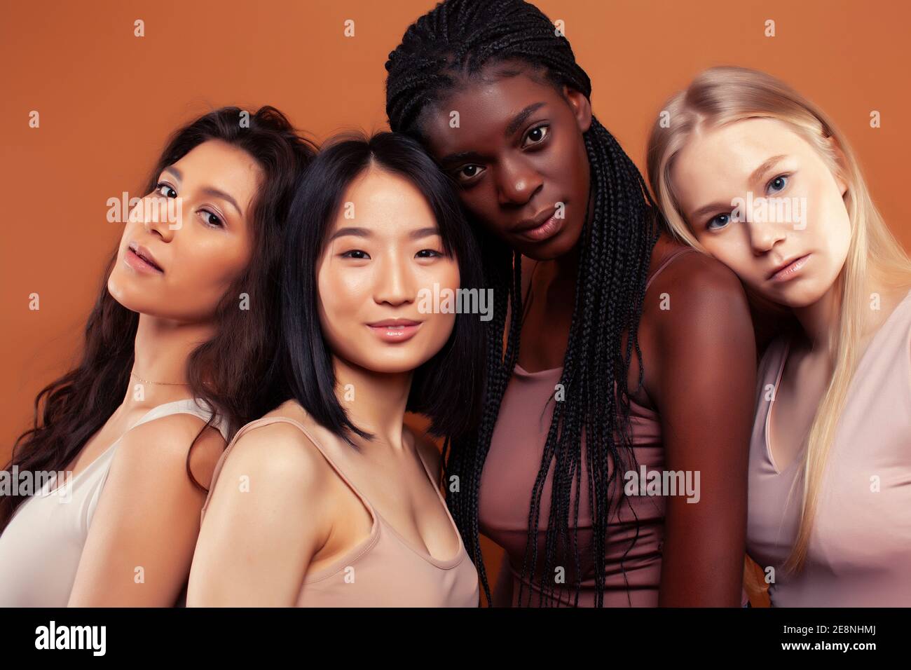 young pretty asian, caucasian, afro woman posing cheerful together on ...