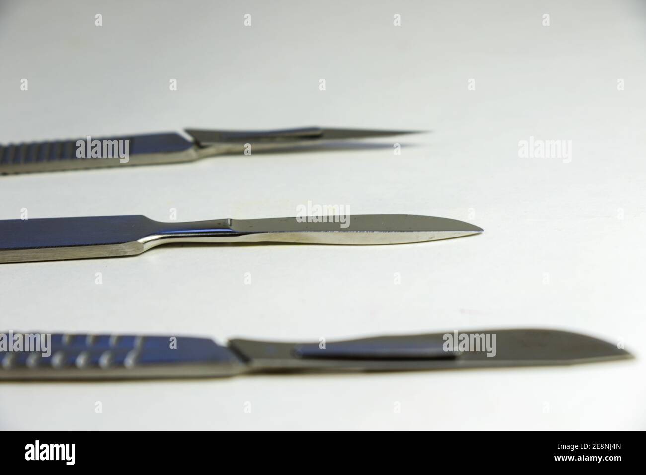 An isolated closeup of stainless steel scalpel kit on white background ...