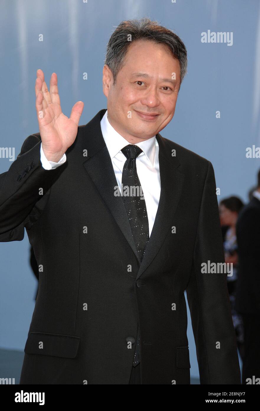 Director Ang Lee poses for pictures as he arrives to the screening of ...