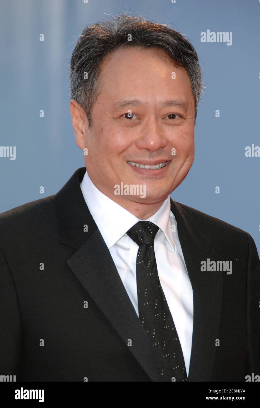 Director Ang Lee poses for pictures as he arrives to the screening of ...