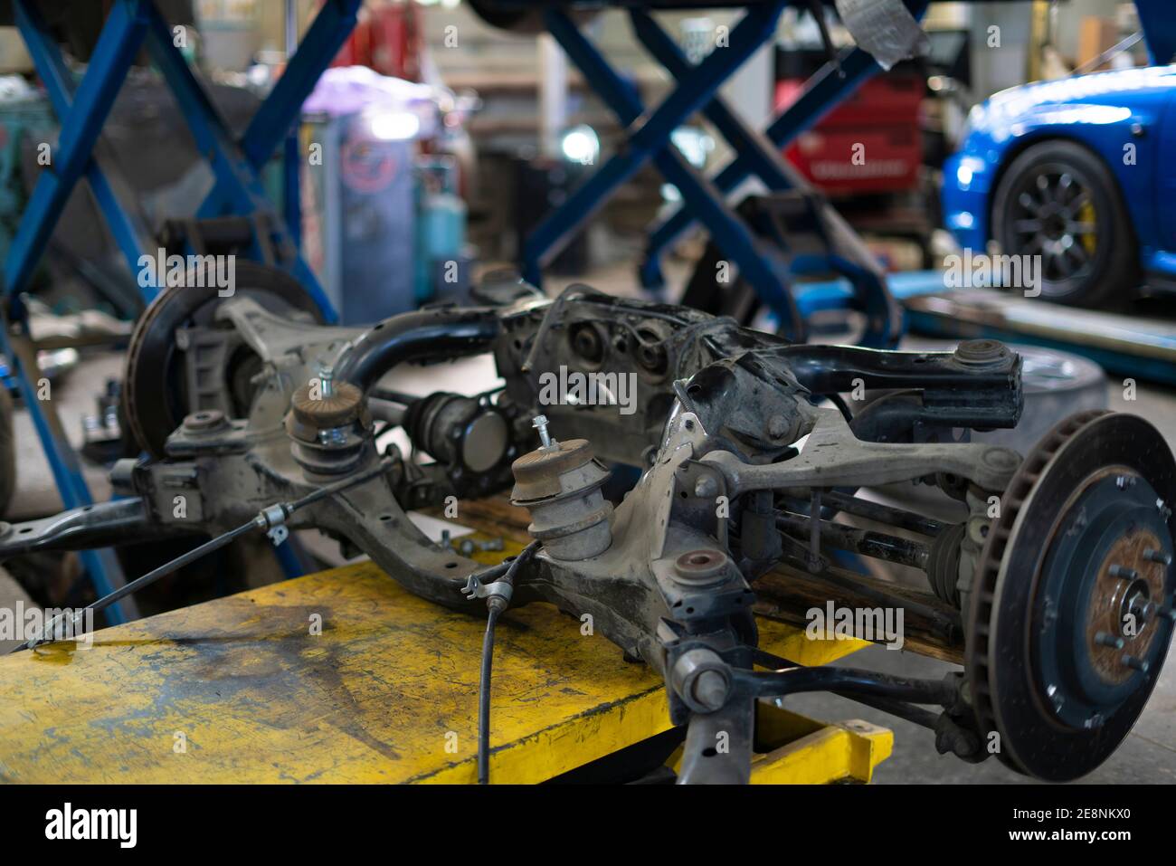 the disassembled car parts in the auto workshop, machine service ...