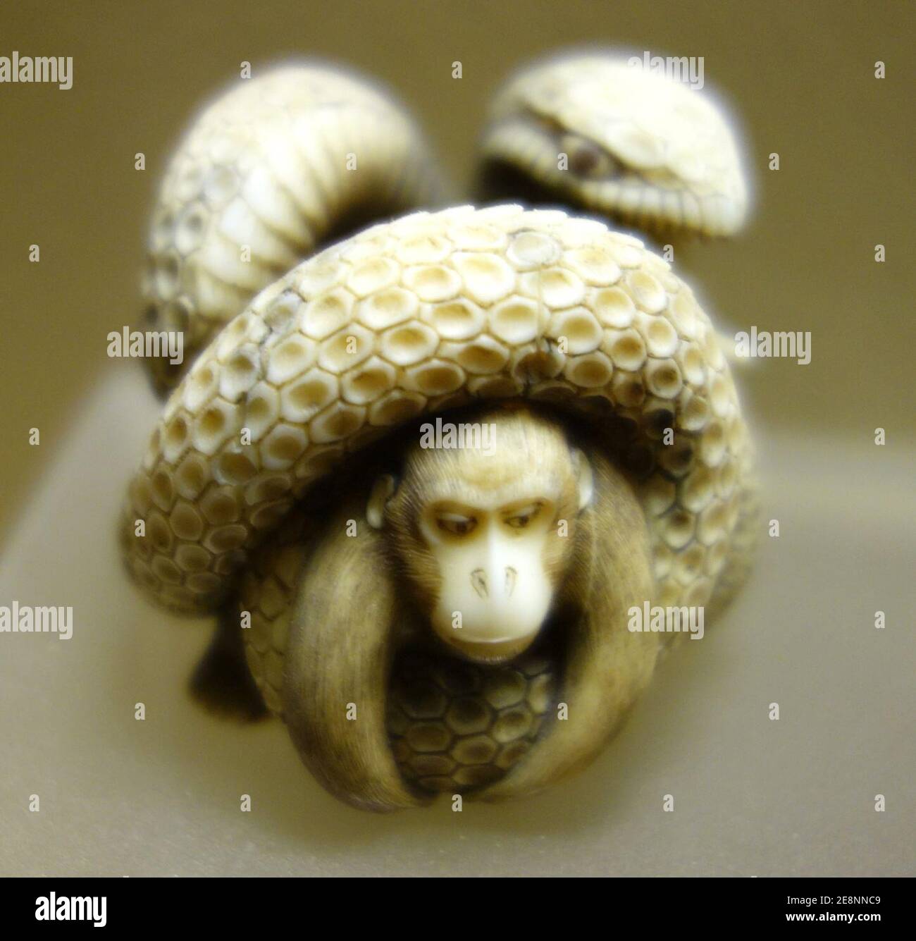 Monkey and snake netsuke Stock Photo - Alamy