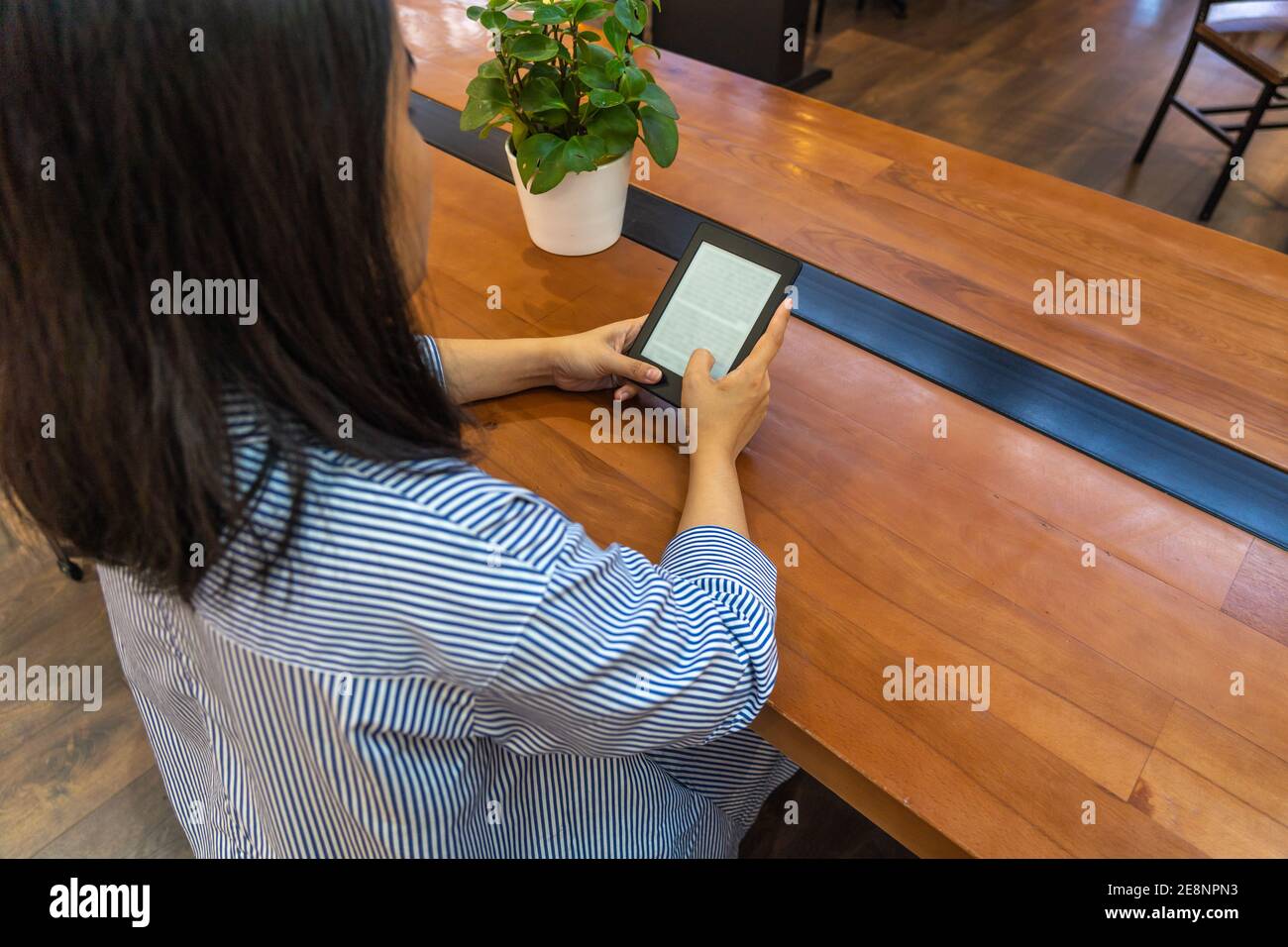 Student reading electronic book from tablet holding on hands Stock ...