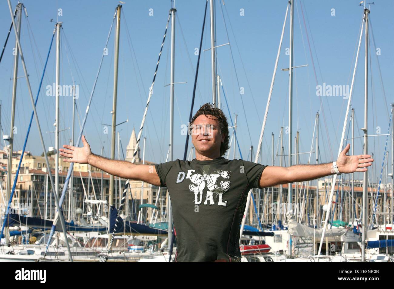 Lyric singer Roberto Alagna poses in the 'Vieux port' of Marseille ...
