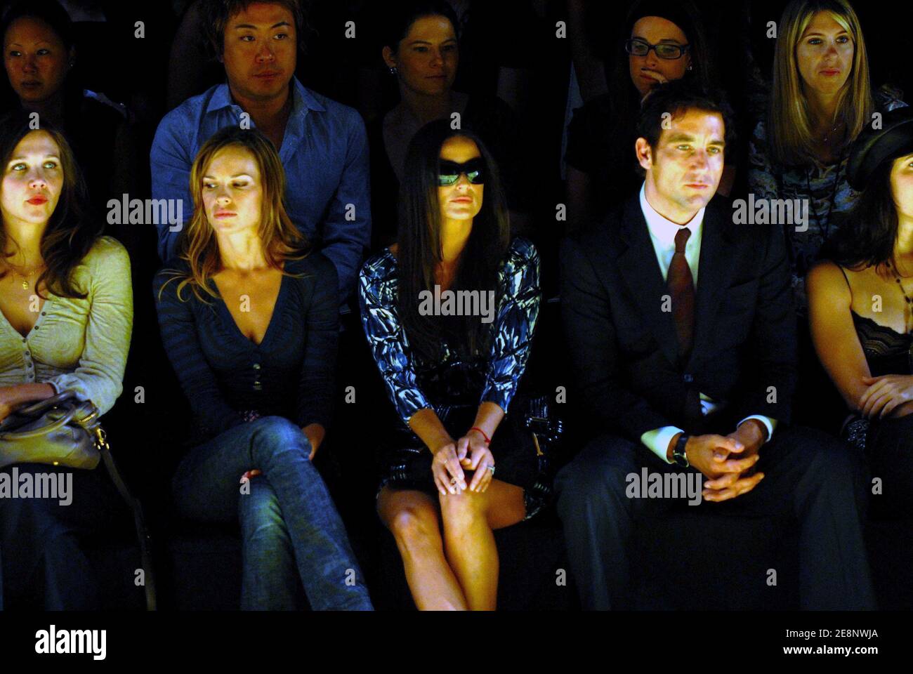 (L-R) Actors Hilary Swank, Demi Moore and Clive Owen sit front row for ...