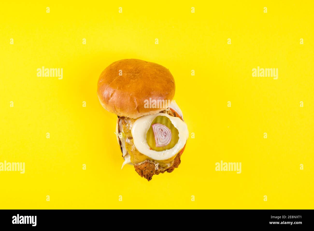 Burger on yellow cheerful Background Stock Photo - Alamy