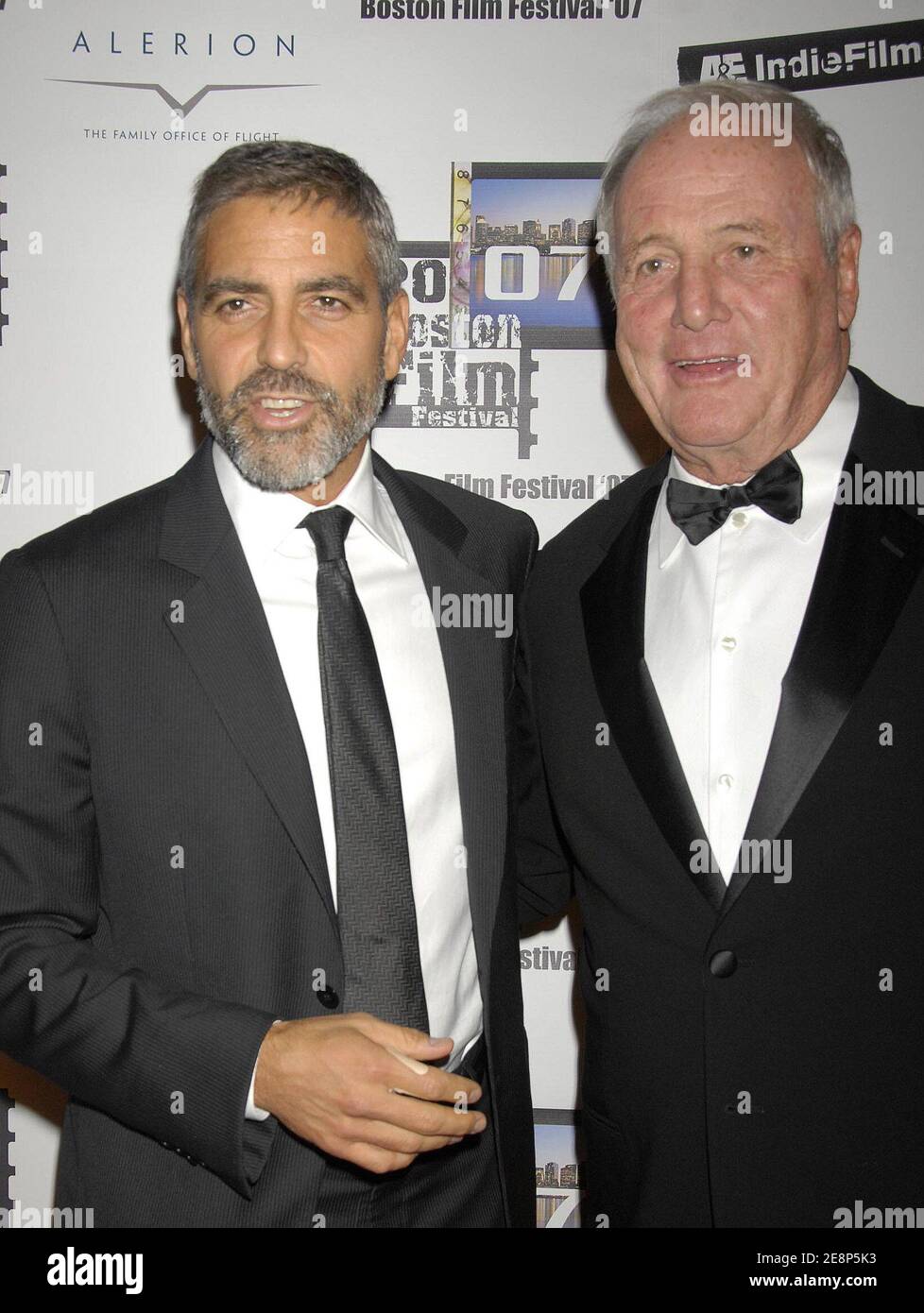 Actor George Clooney (L) and producer Jerry Weintraub attend a ...