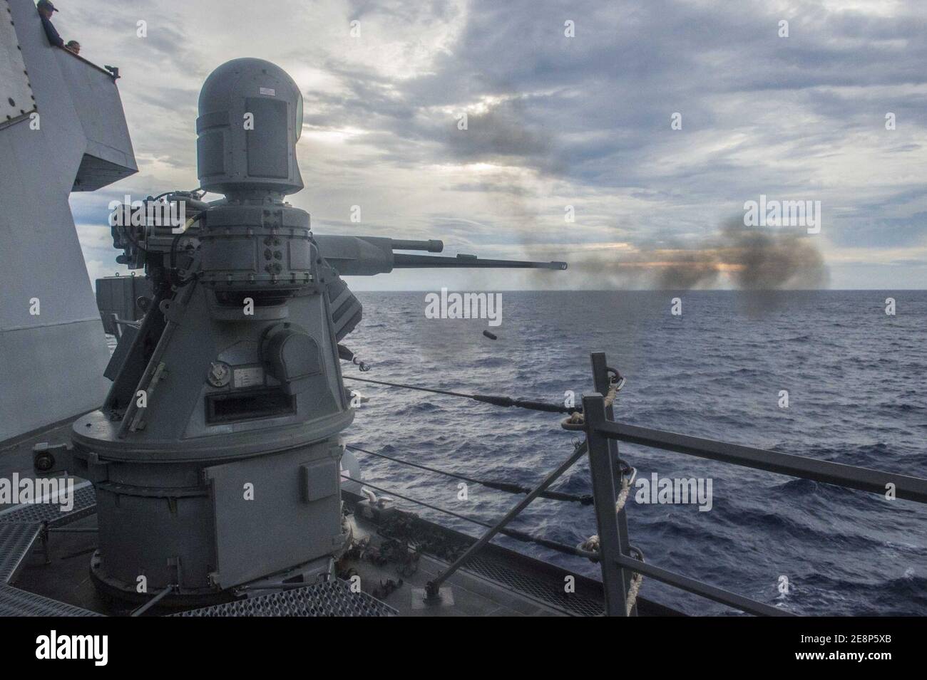 Mk 38 Mod 2 chain gun of USS Mustin (DDG-89) firing during gunnery ...