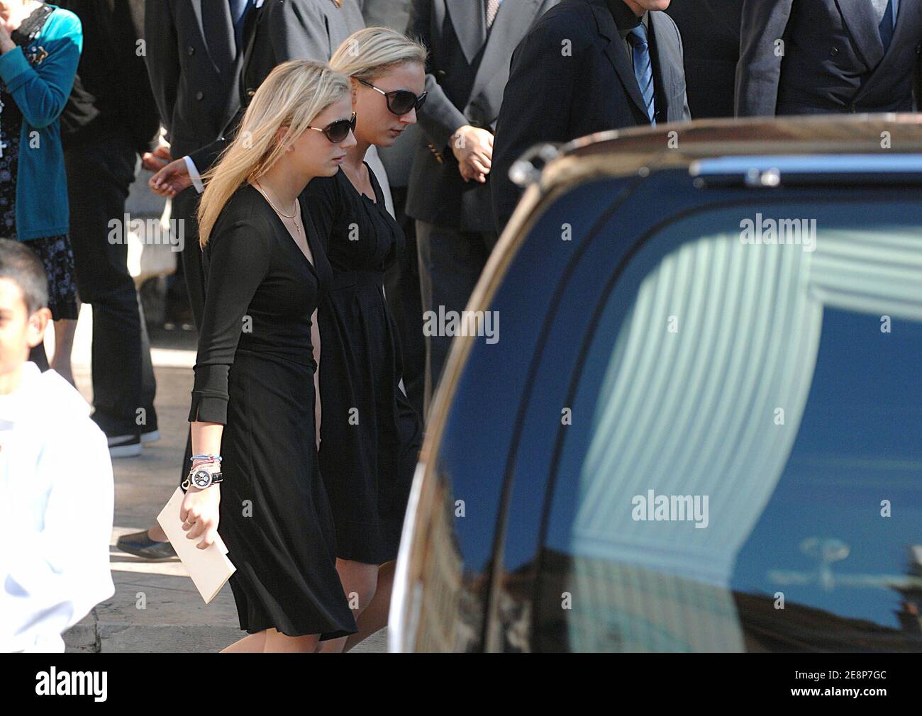 His daughters Jeanne-Marie and Judith Martin leave Saint-Jean Cathedral ...