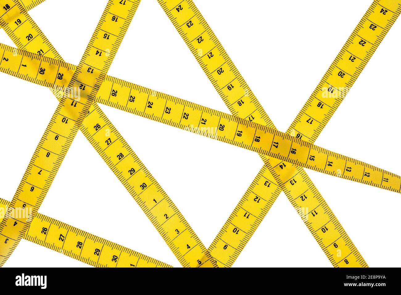Yellow measuring tape isolated on white background Stock Photo - Alamy