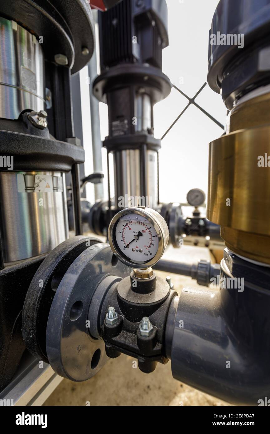 Close up of water pressure sensor or manometer with pipes and valves ...