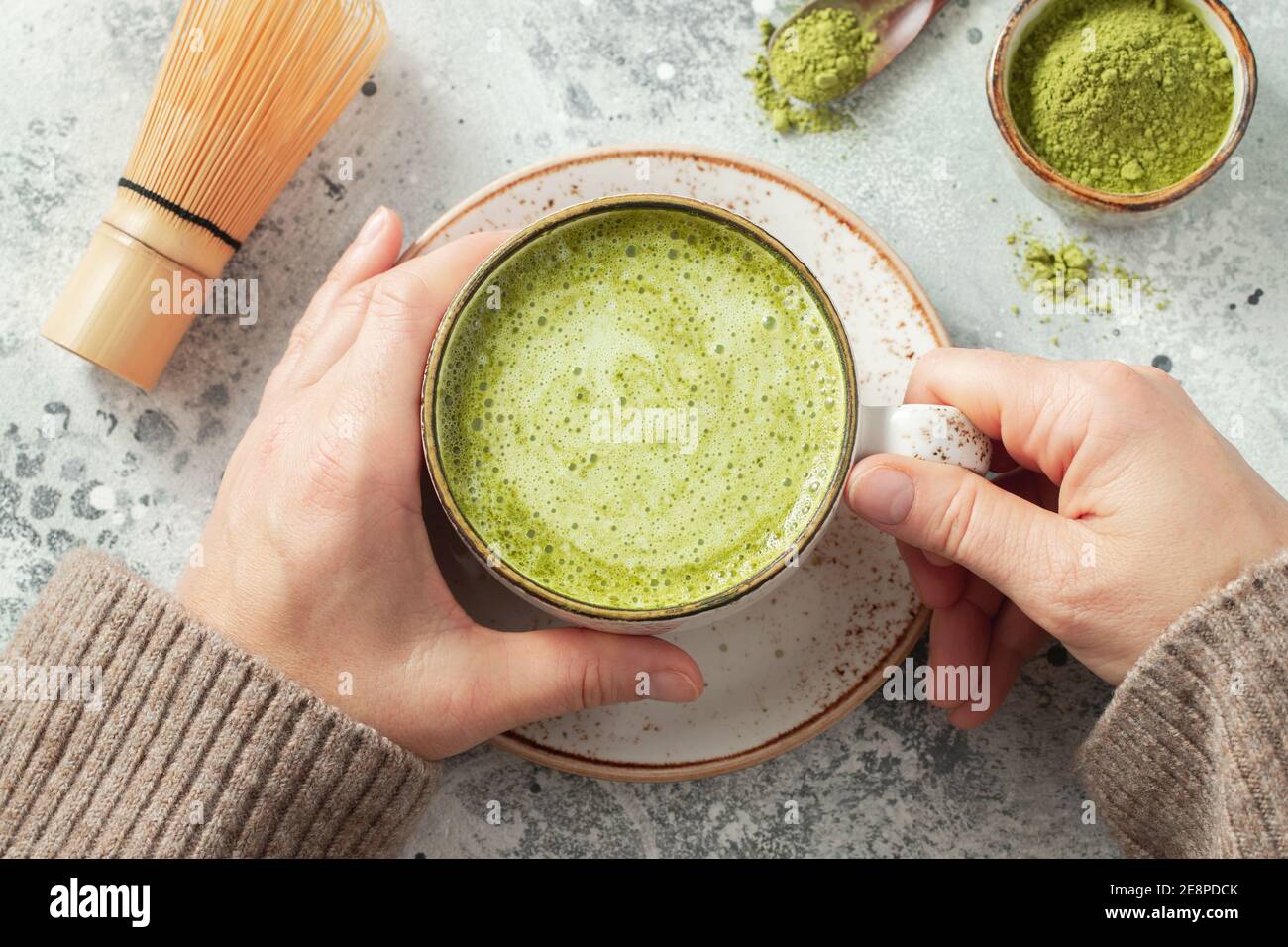 Cup of Matcha Green Tea in woman hands. Top view. flat lay Stock Photo ...