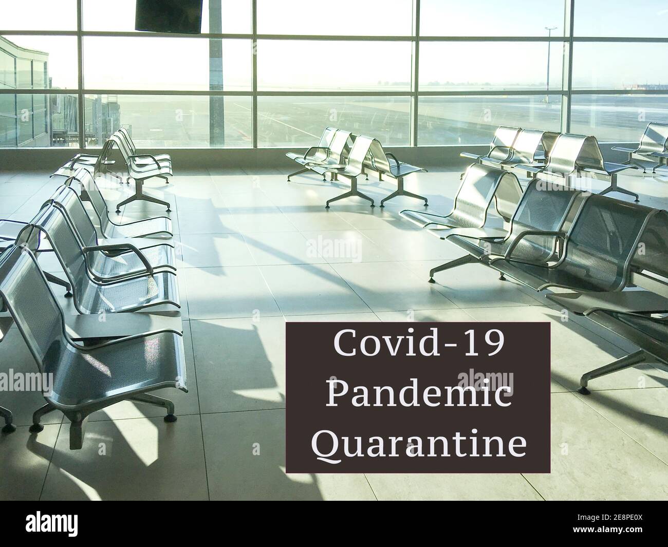 Covid-19 pandemic quarantine sign warning. Empty airport terminal ...