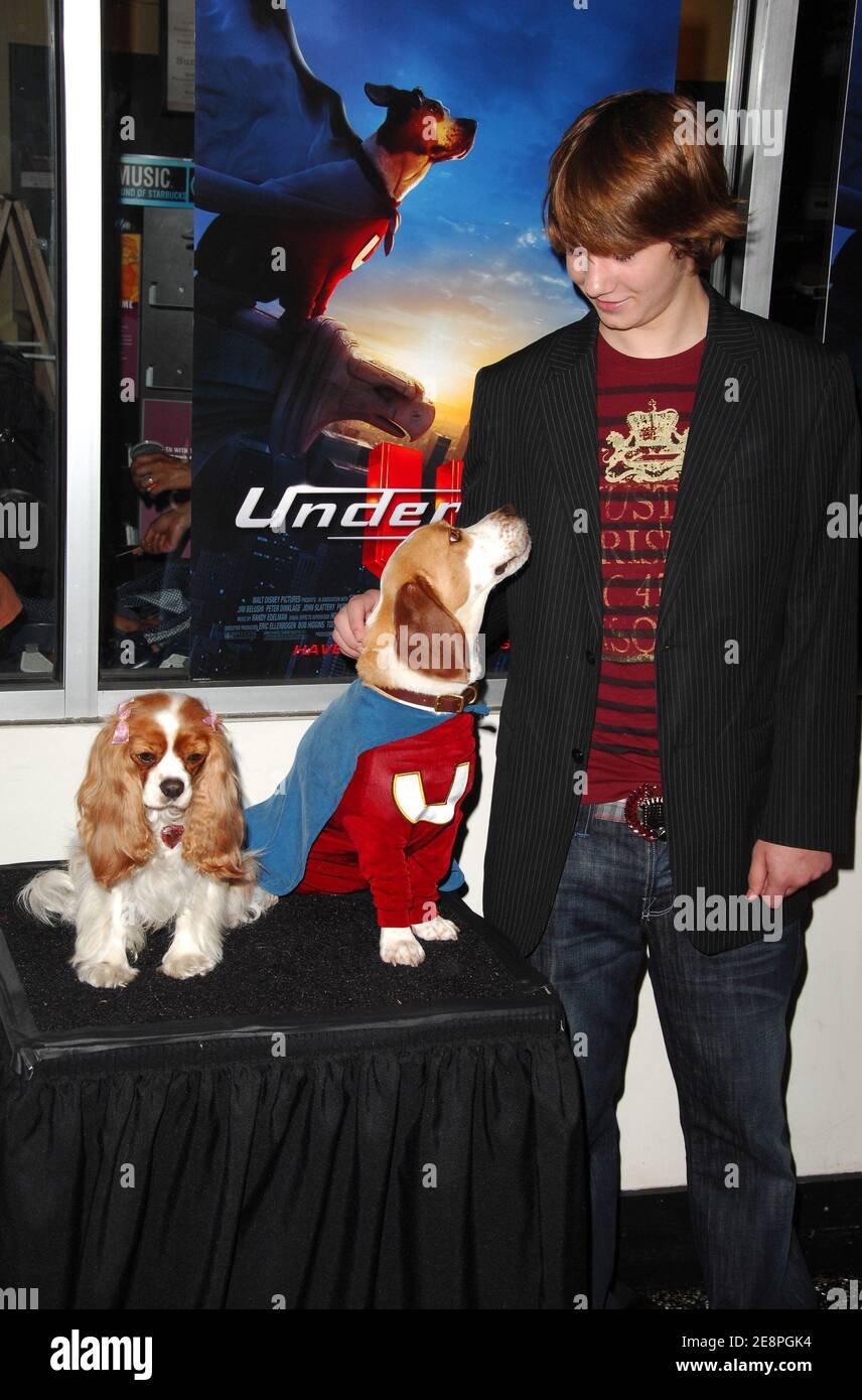 Actor Alex Neuberger poses with Leo the dog who plays Underdog and Ginger the dog that plays ...
