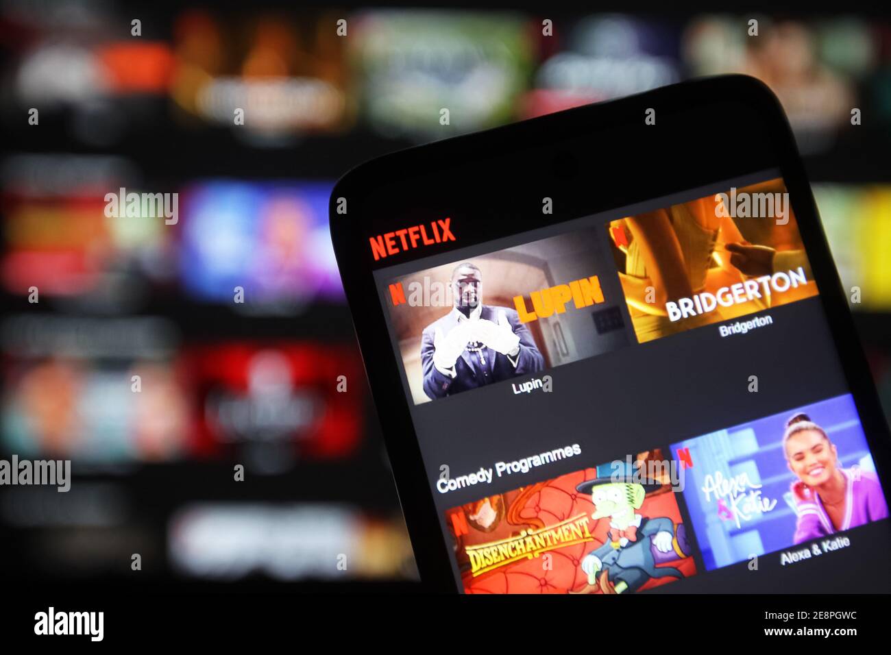 In this photo illustration the Netflix logo seen displayed on a mobile ...