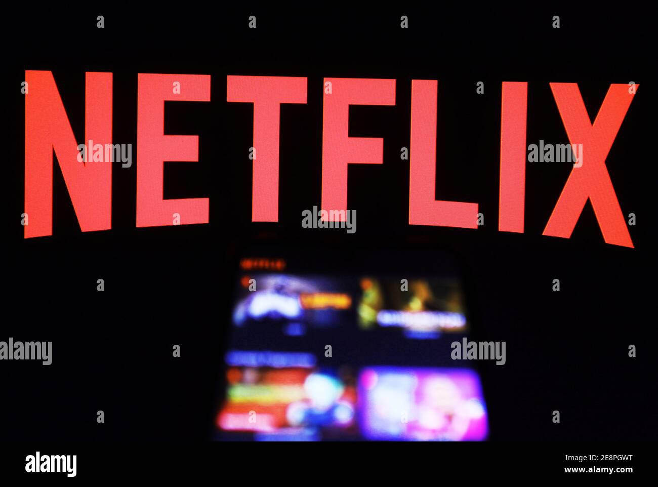In this photo illustration the Netflix logo seen displayed on a mobile ...