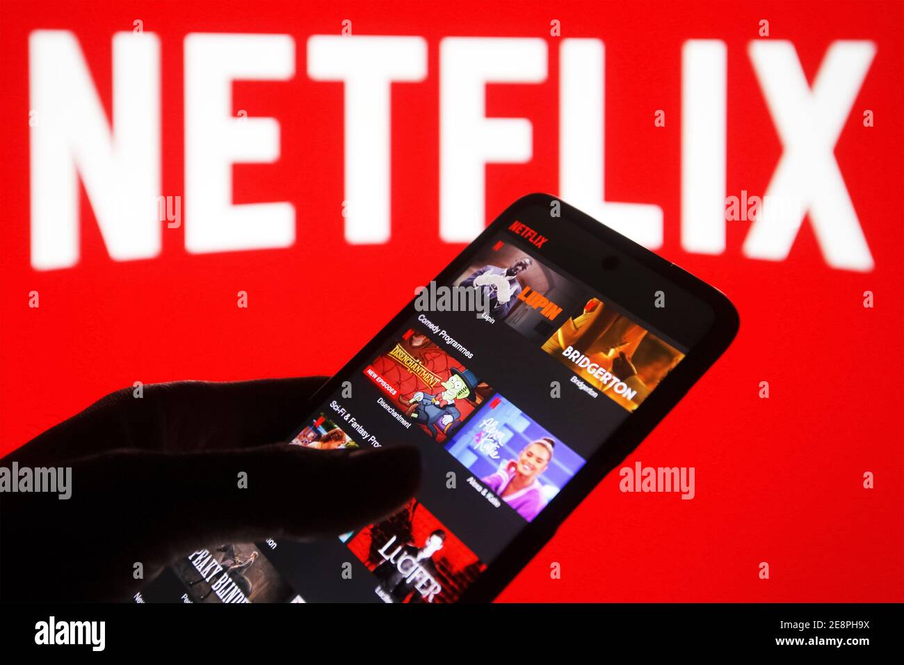 In this photo illustration the Netflix logo seen displayed on a mobile ...