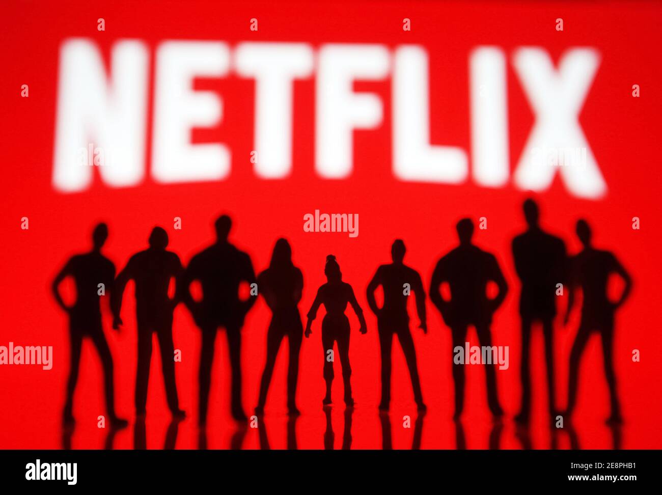 In this photo illustration silhouettes of people seen displayed in ...