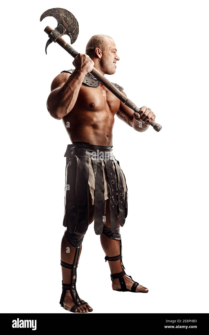 Studio shot of muscular ancient warrior man posing with axe. Isolated ...
