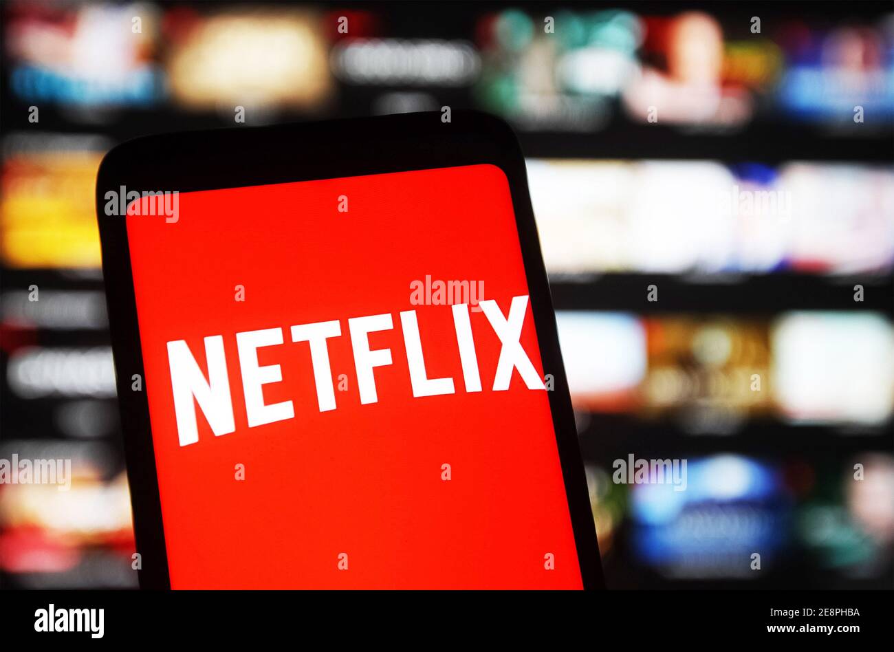 In this photo illustration the Netflix logo seen displayed on a mobile ...