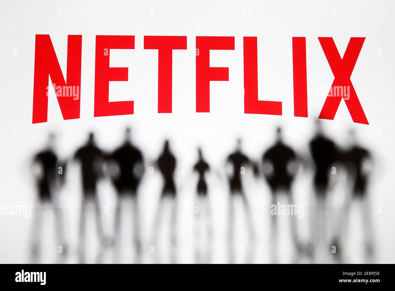In this photo illustration the Netflix logo seen displayed in front of ...