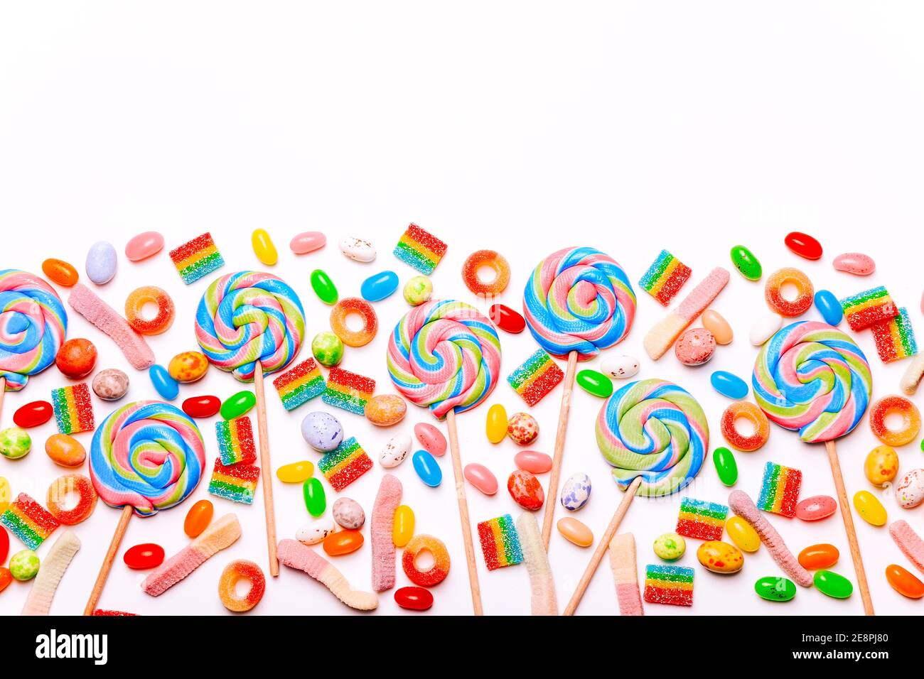 Mixed collection of colorful candy, on white background. Flat lay, top ...