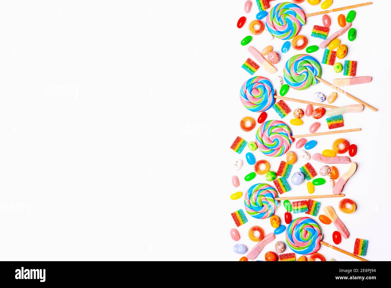 Mixed collection of colorful candy, on white background. Flat lay, top ...
