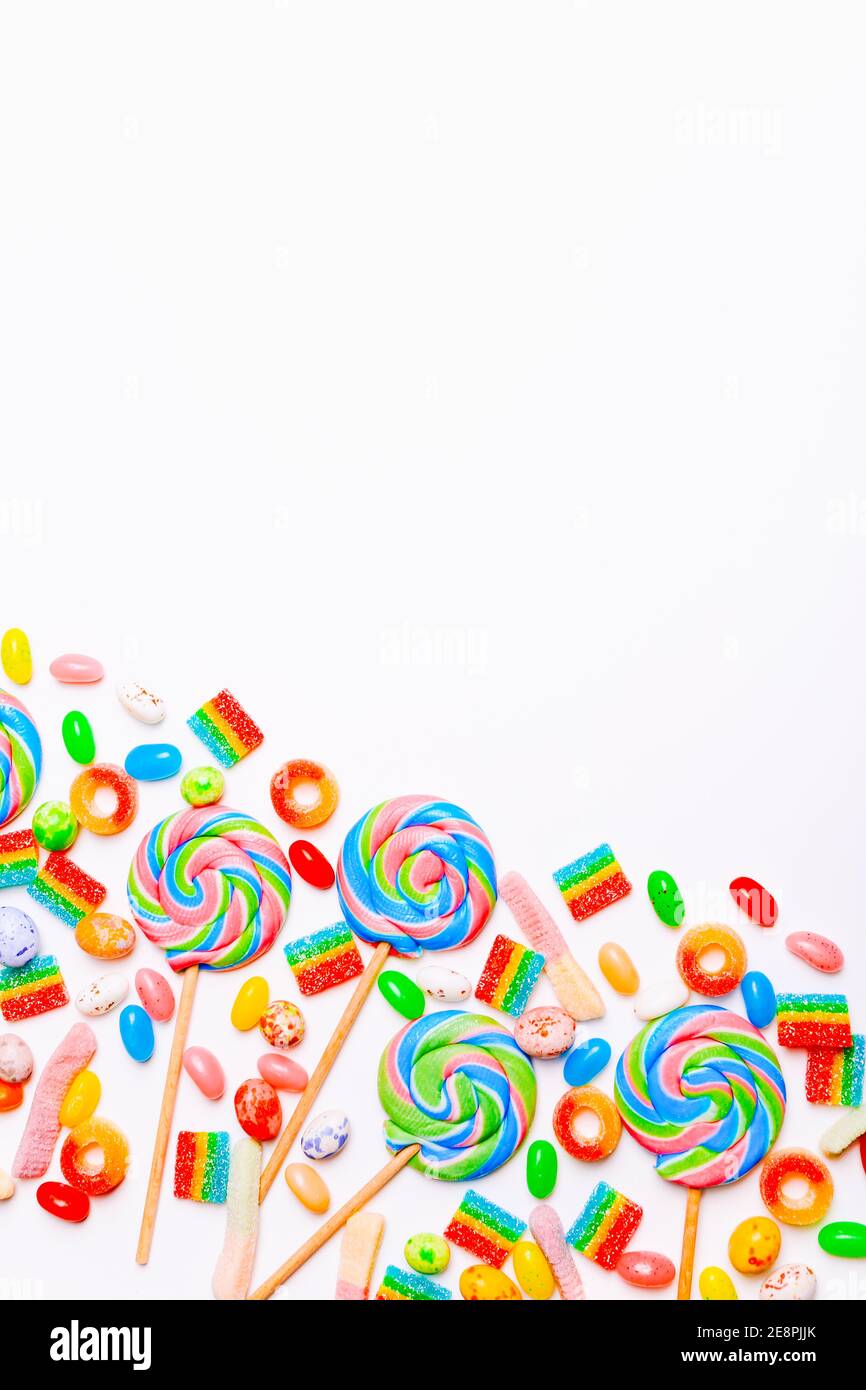 Mixed collection of colorful candy, on white background. Flat lay, top ...